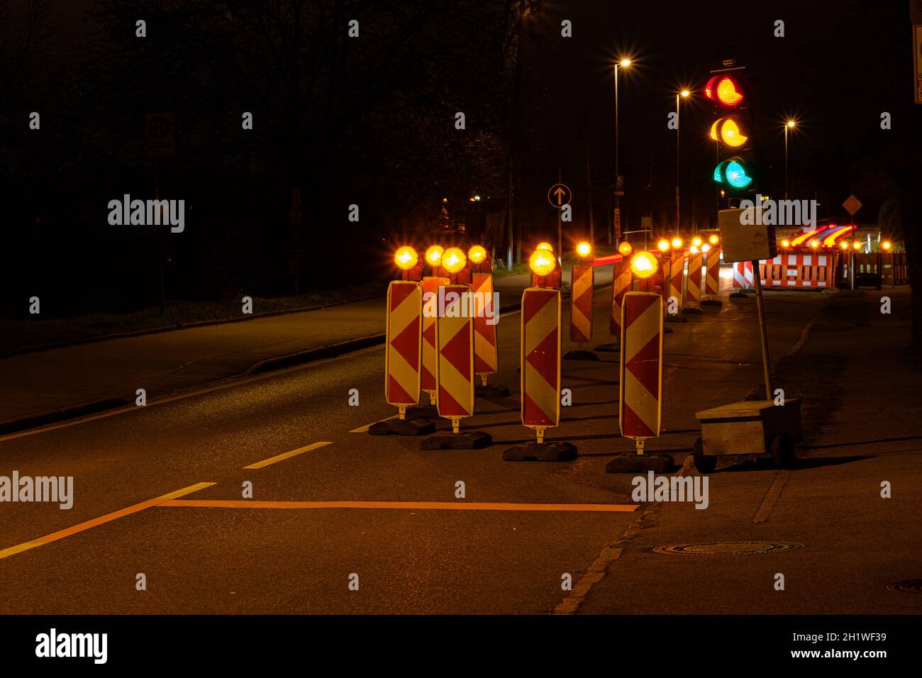 Traffic light at a construction site in night Stock Photo - Alamy
