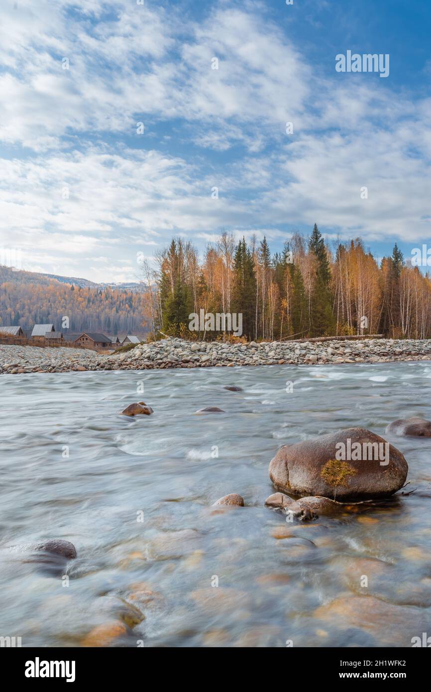 Autumn landscape of the river and forest in Hemu Village, a historic ...