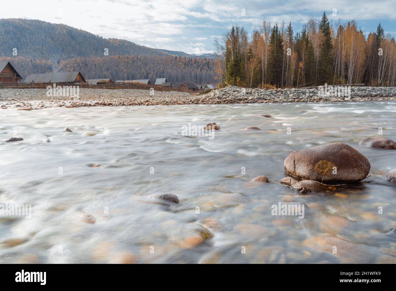 Autumn landscape of the river and forest in Hemu Village, a historic ...