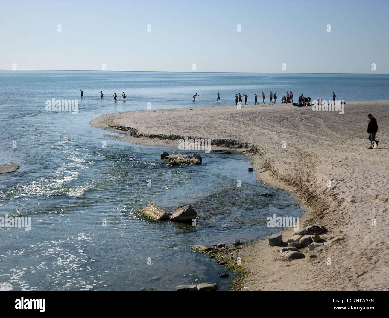 People on the sandy shore of the Caspian Sea. Kazakhstan. Mangistau ...
