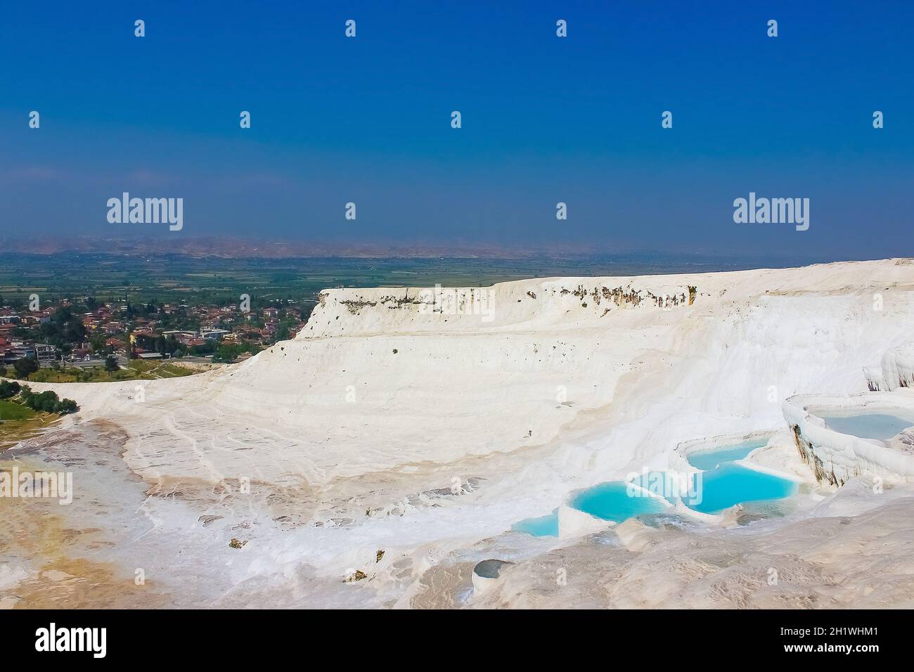 Travertines in Turkey. Calcite cliff of Pamukkale at sunny day Stock ...