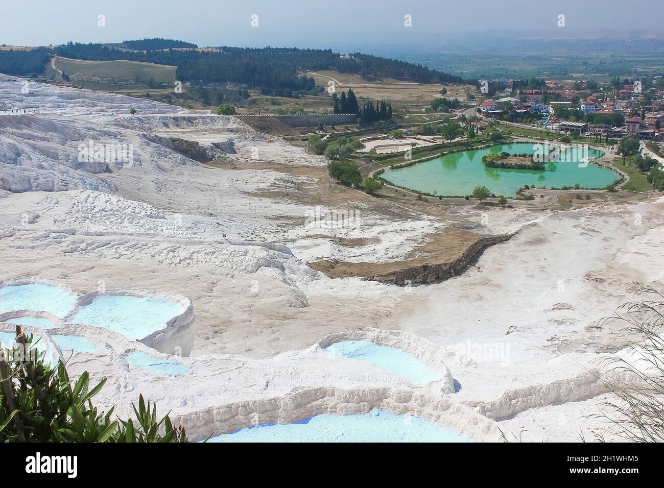 Travertines in Turkey. Calcite cliff of Pamukkale at sunny day Stock ...
