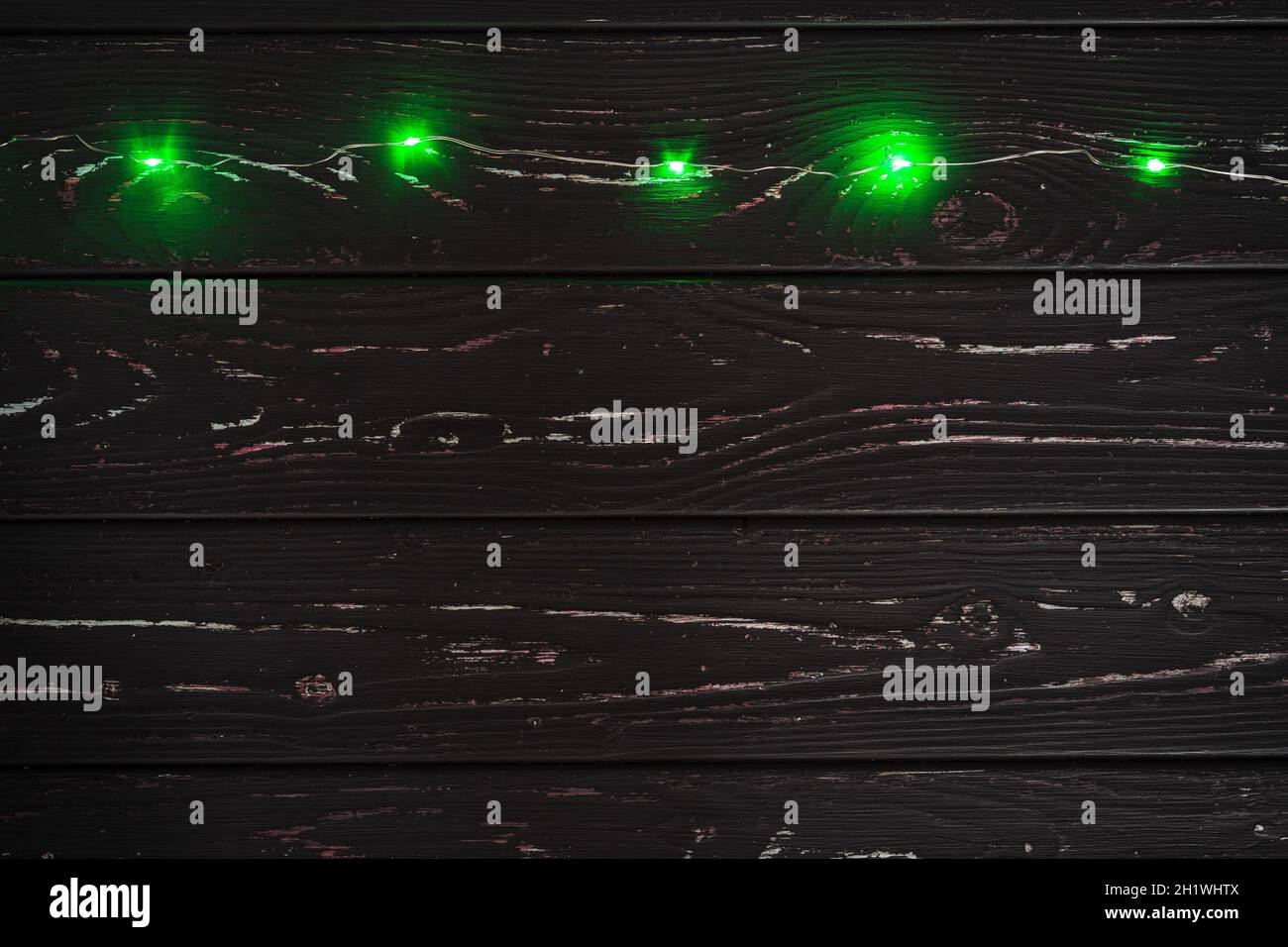 Garland with green light elements in the dark close up Stock Photo - Alamy