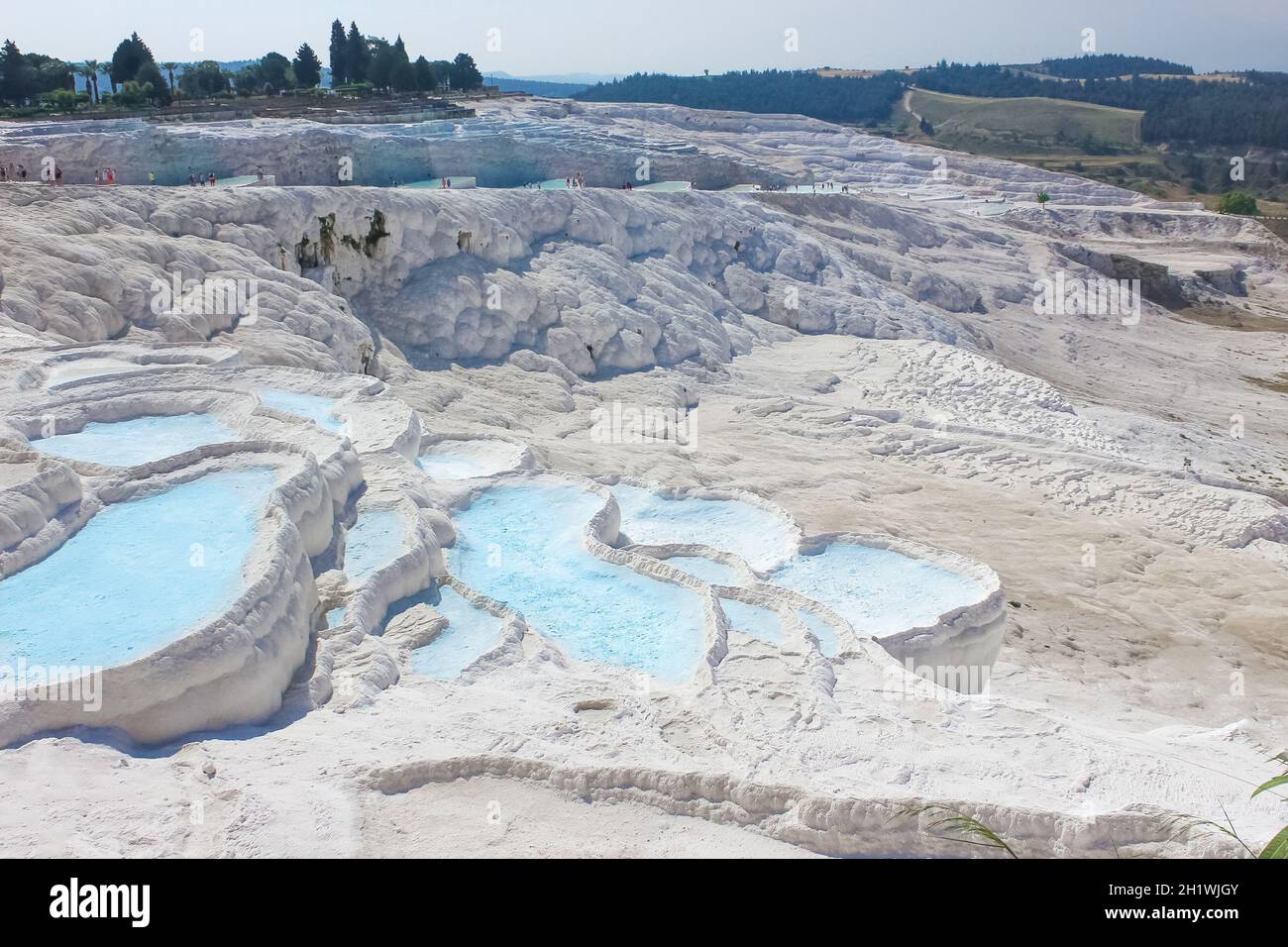 Travertines in Turkey. Calcite cliff of Pamukkale at sunny day Stock ...