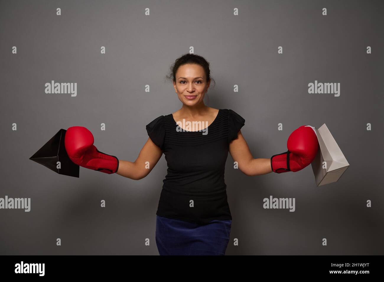 Woman holds boxing gloves hi-res stock photography and images - Alamy