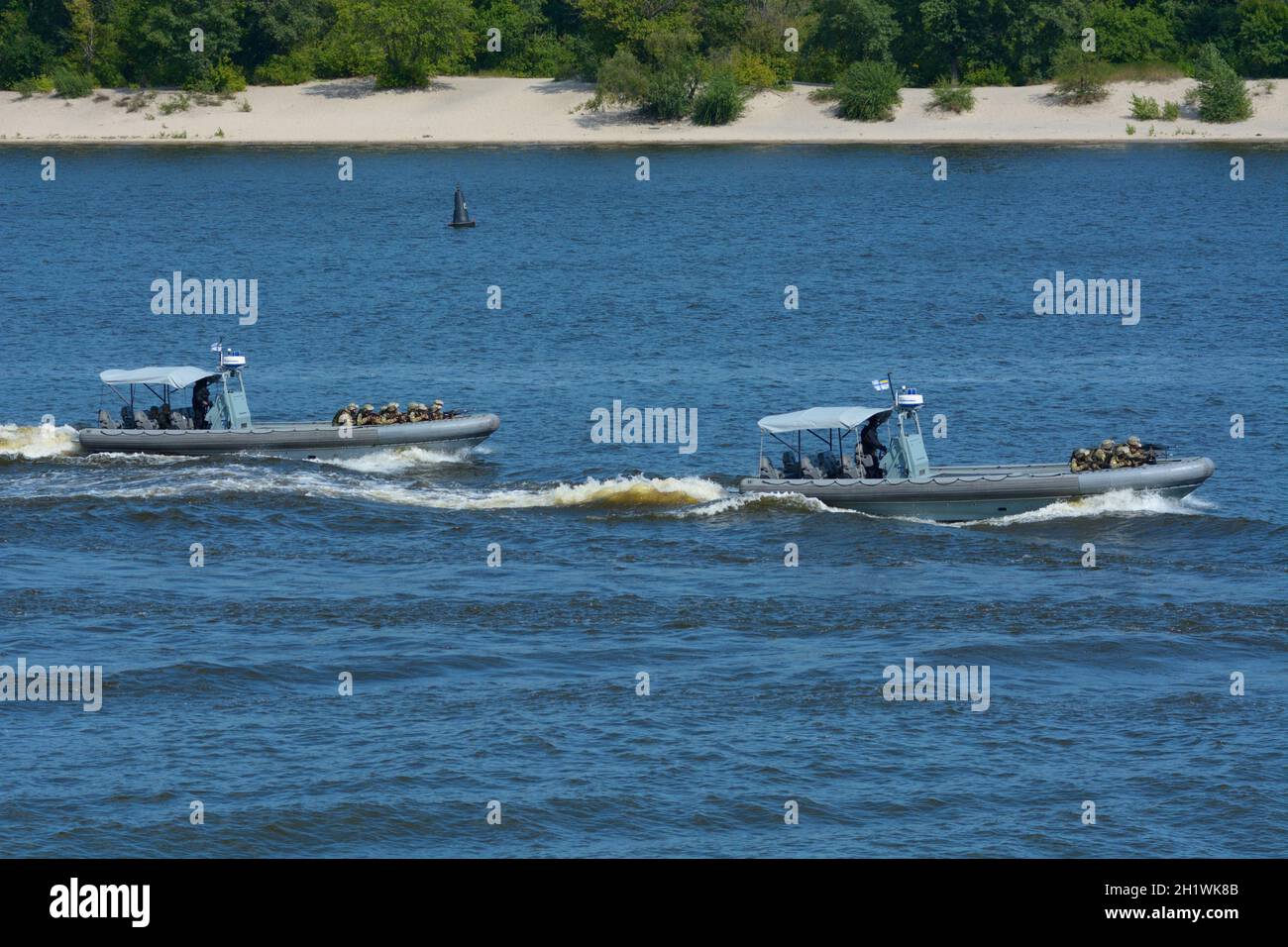 Miltary boats floating on the water, soldiers of Seaborne Special ...