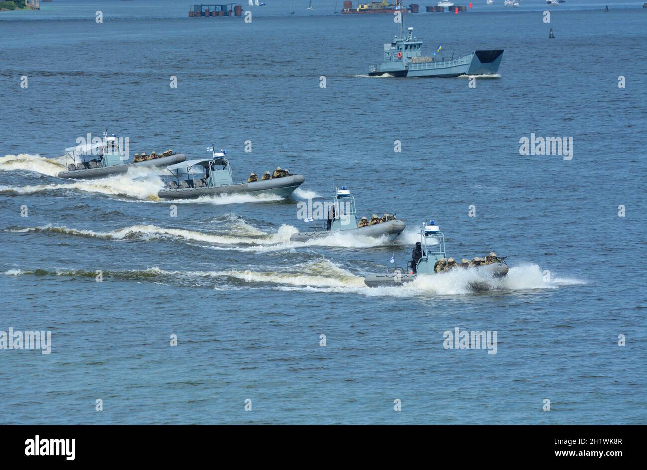 Miltary boats floating on the water, soldiers of Seaborne Special ...