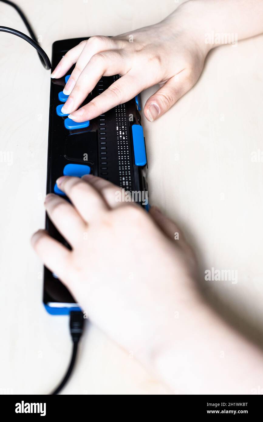 Moscow, Russia - June 5, 2021: hands on keys of Focus 40 Blue Braille ...
