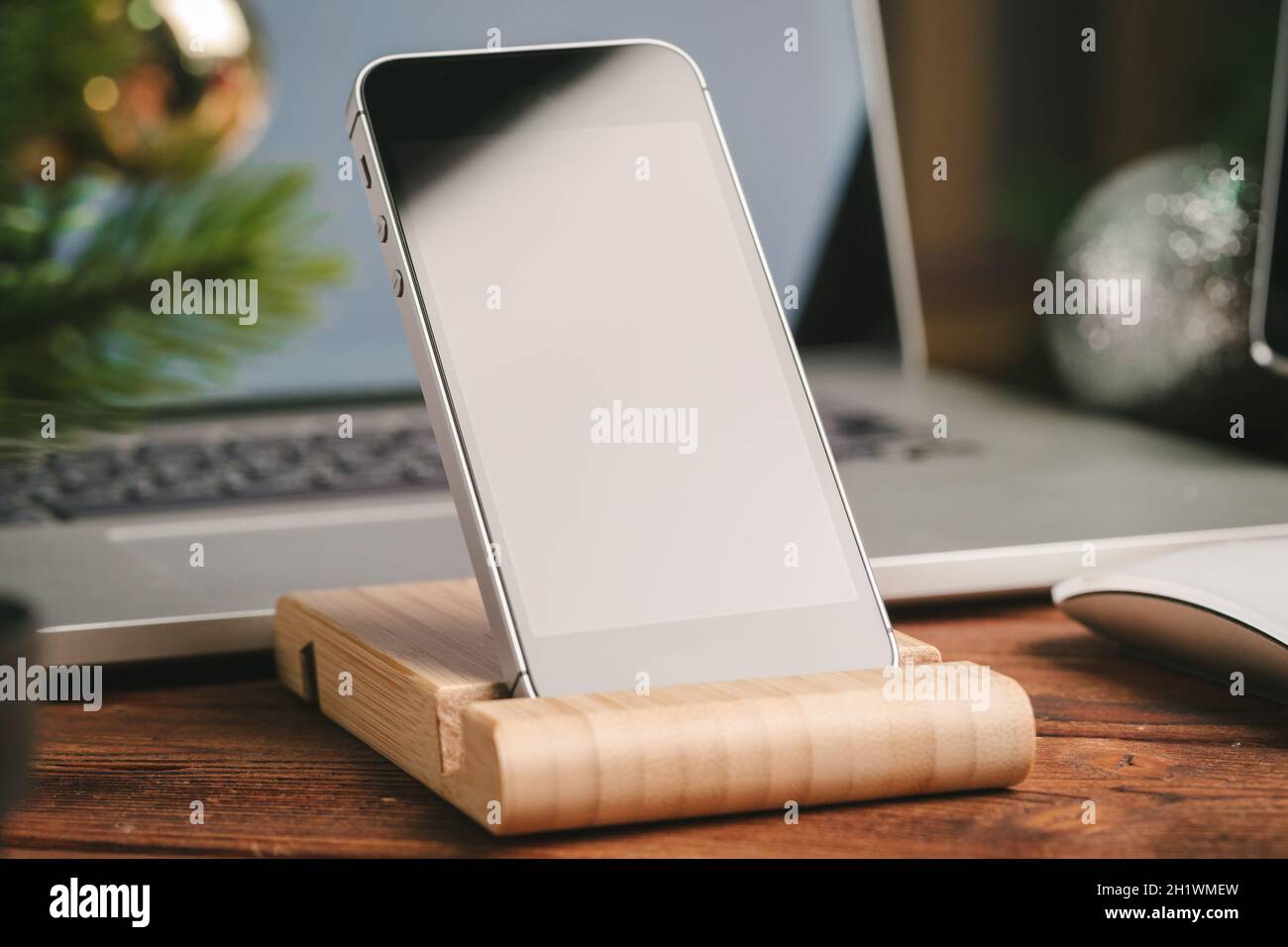 Close up shot of digital device on wooden table with christmas ...