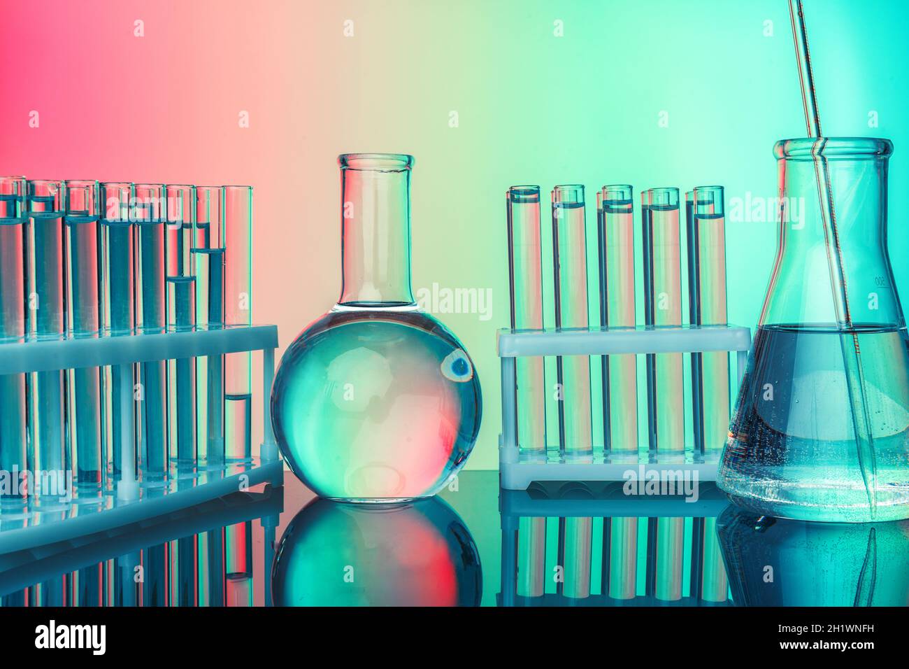 Row of test tubes with liquids on blue and green toned background Stock ...