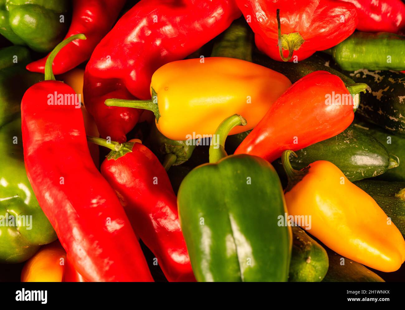 Close up crop still life collection of red green yellow peppers Stock ...