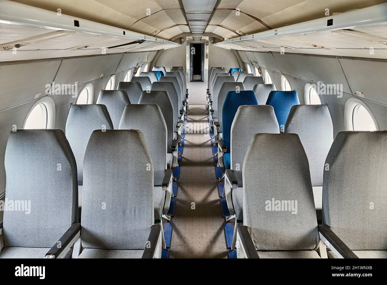 Empty rows of seats on an old plane Stock Photo - Alamy