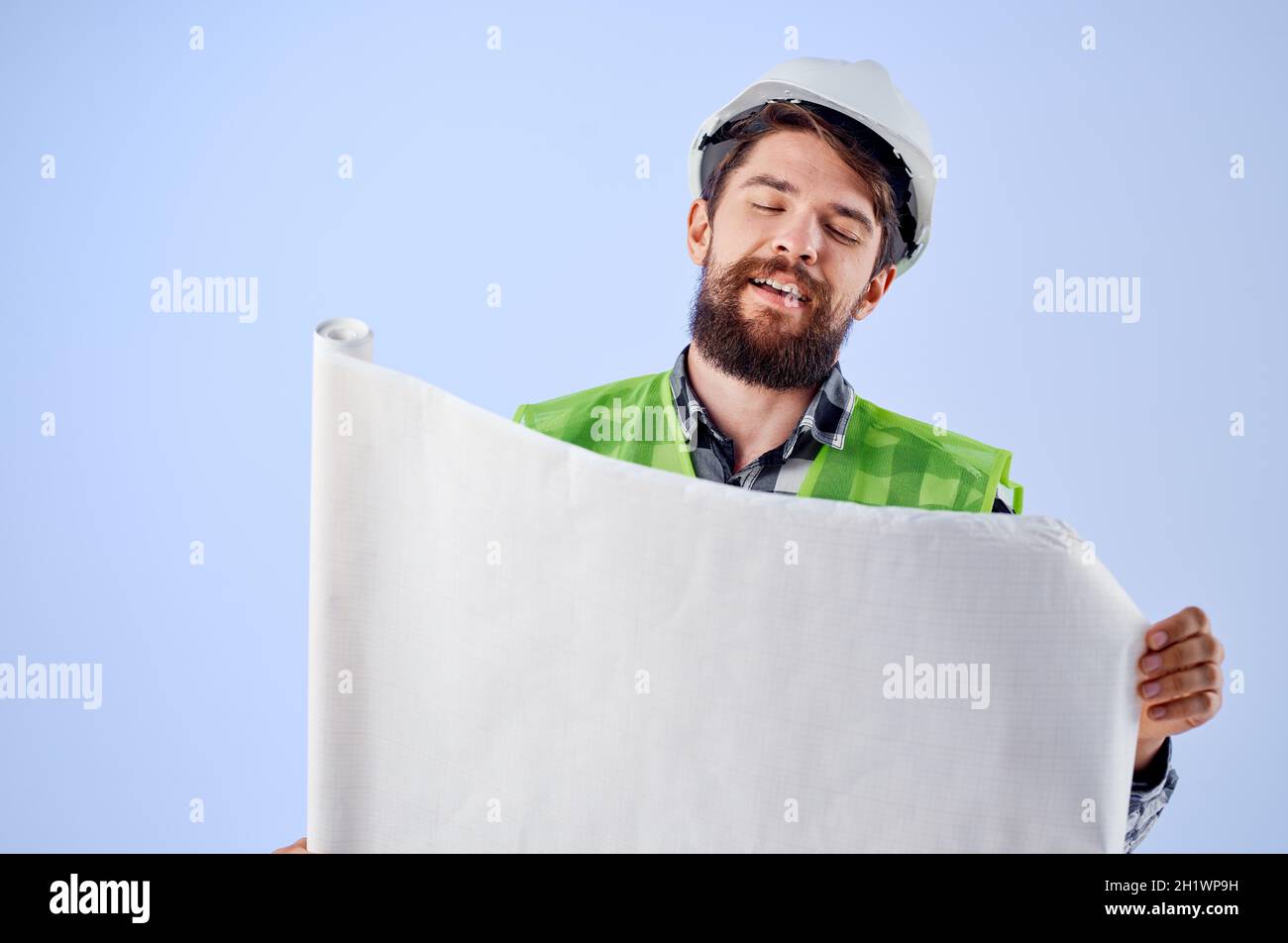 engineer with documents and drawings blueprints isolated background ...