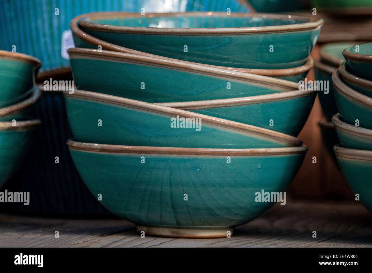 Ceramic bowls in turquoise color at the street market to sell Stock ...