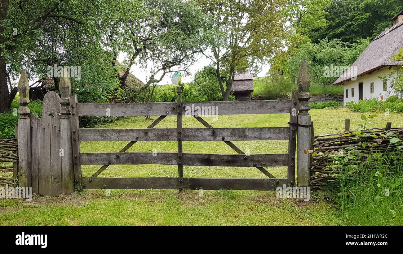 Closed wooden gate from the boards in the village or village. Vintage ...