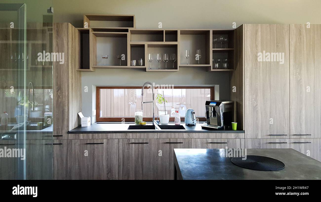 Ukraine, Kiev - September 24, 2019: Modern kitchen with brown wooden ...