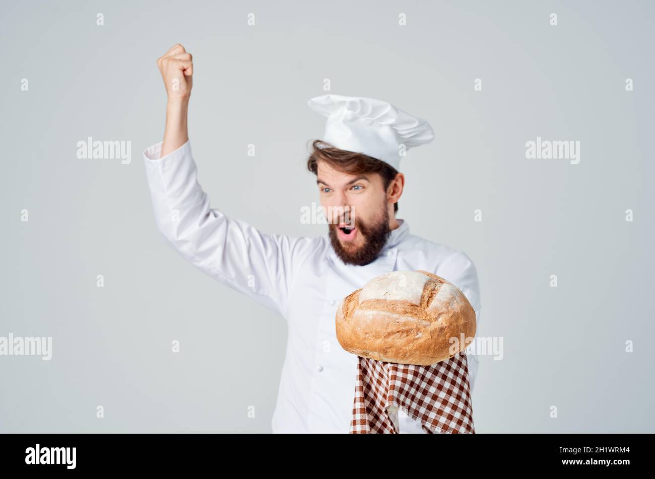 bearded man chef with bread in hand culinary industry Stock Photo - Alamy