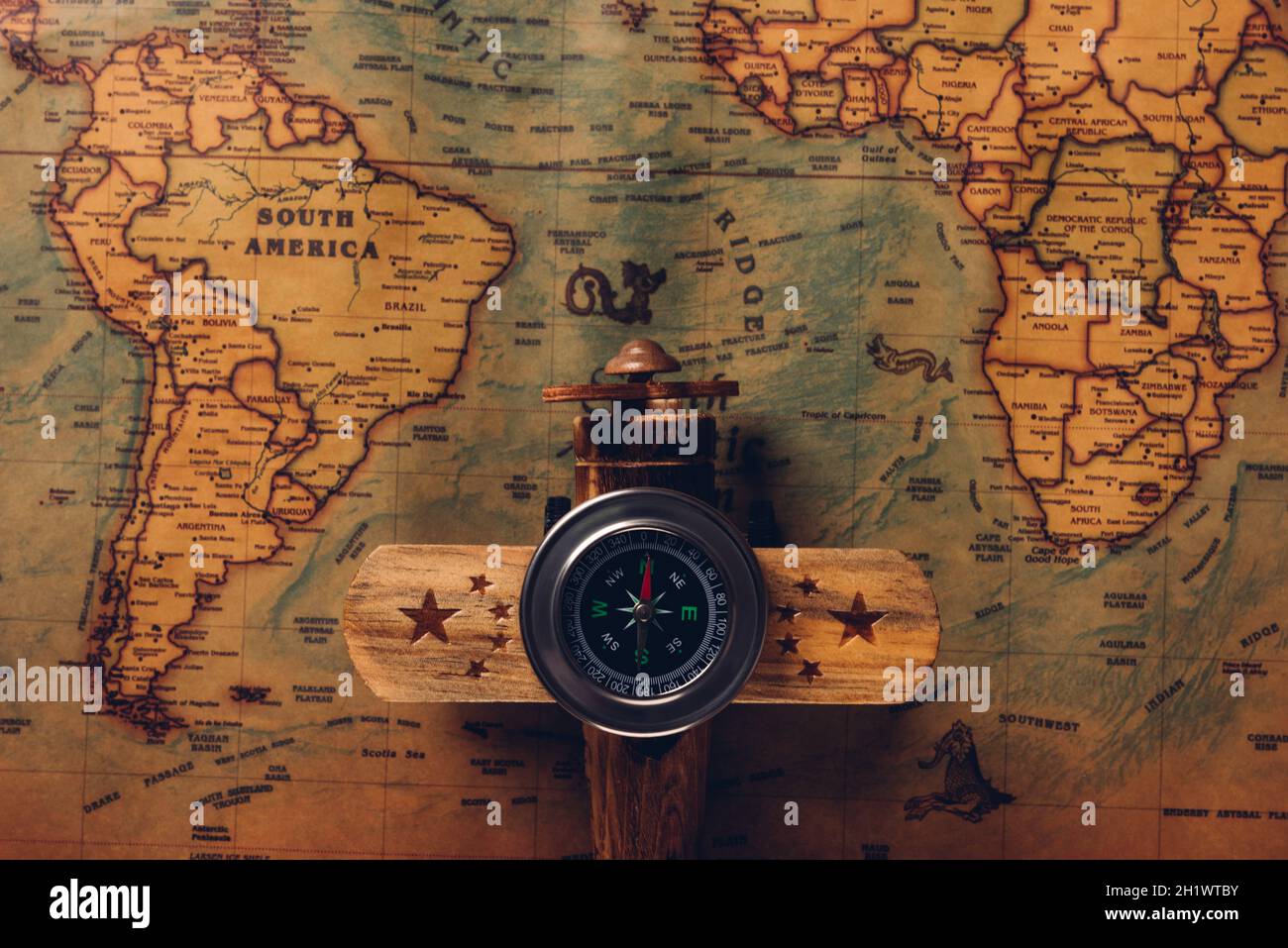 Old compass discovery and wooden plane on vintage paper antique world ...