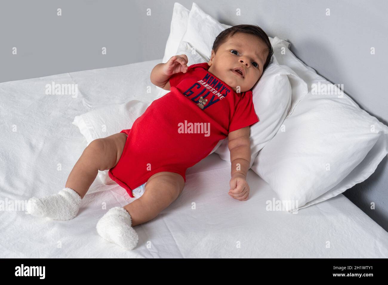 Cute babies wearing red hi-res stock photography and images - Alamy