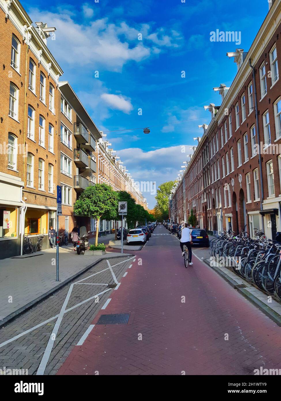 Amsterdam, Netherlands, October 2018: Amsterdam city street painted red ...