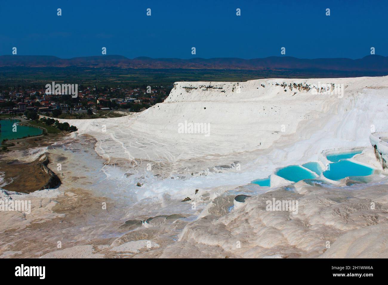 Travertines in Turkey. Calcite cliff of Pamukkale. Sunny morning Stock ...