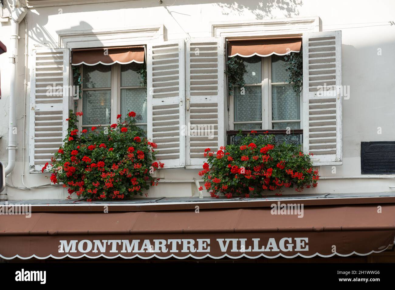 Windows with shutters of old buildings on Montmartre, Paris Stock Photo ...