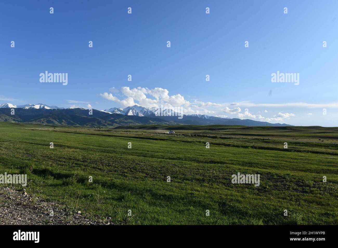 Mountain landscape with clouds and road, Kazakhstan, Almaty region ...
