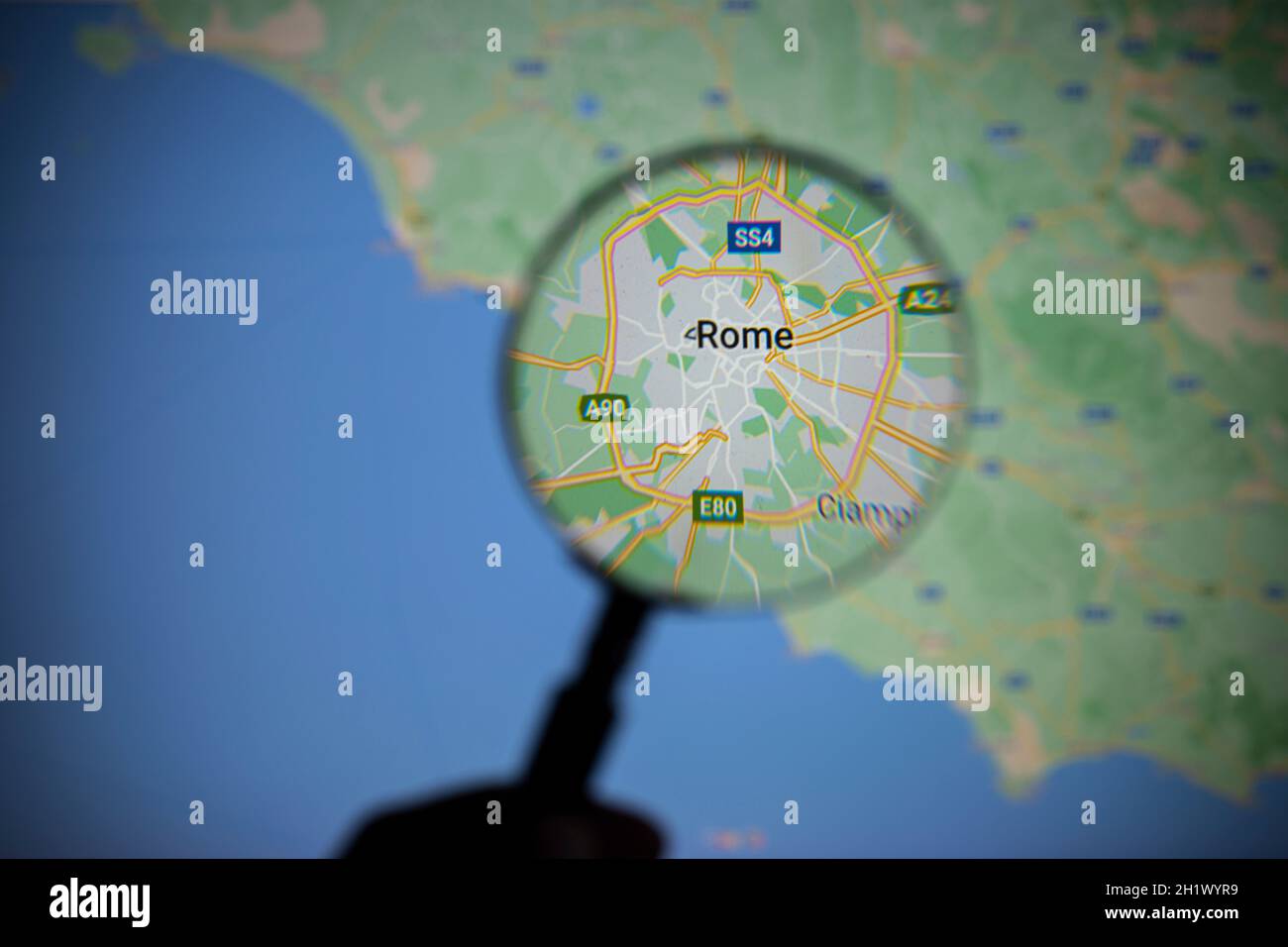 view of the city of Rome, capital of Italy, through a magnifying glass ...