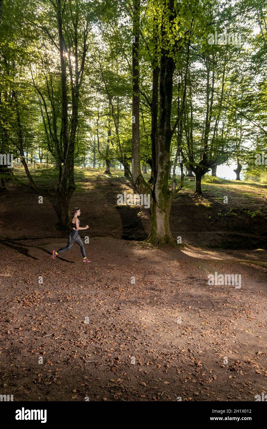Woman running through field in hi-res stock photography and images - Alamy