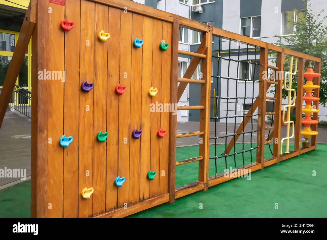 A courtyard of high-rise buildings with a modern and large playground ...