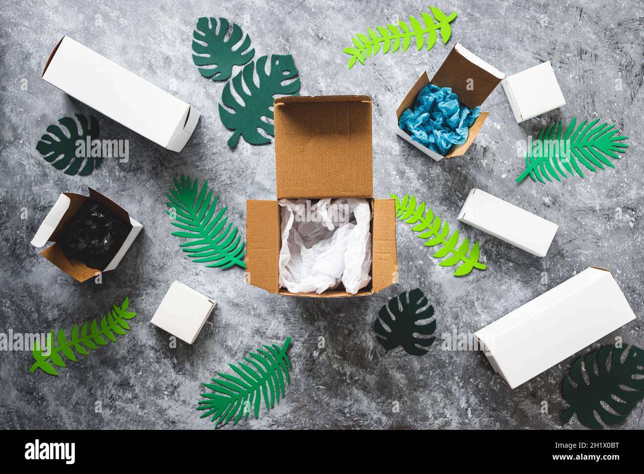 online delivery parcel boxes with different shapes surrounded by green ...