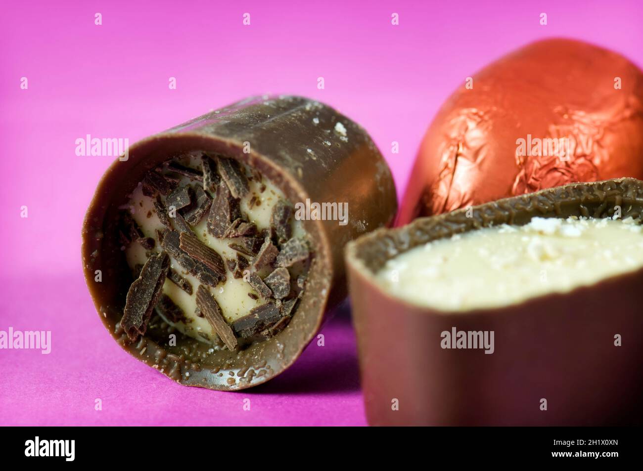 Close up of three luxury continental or Belgian assorted chocolates on ...