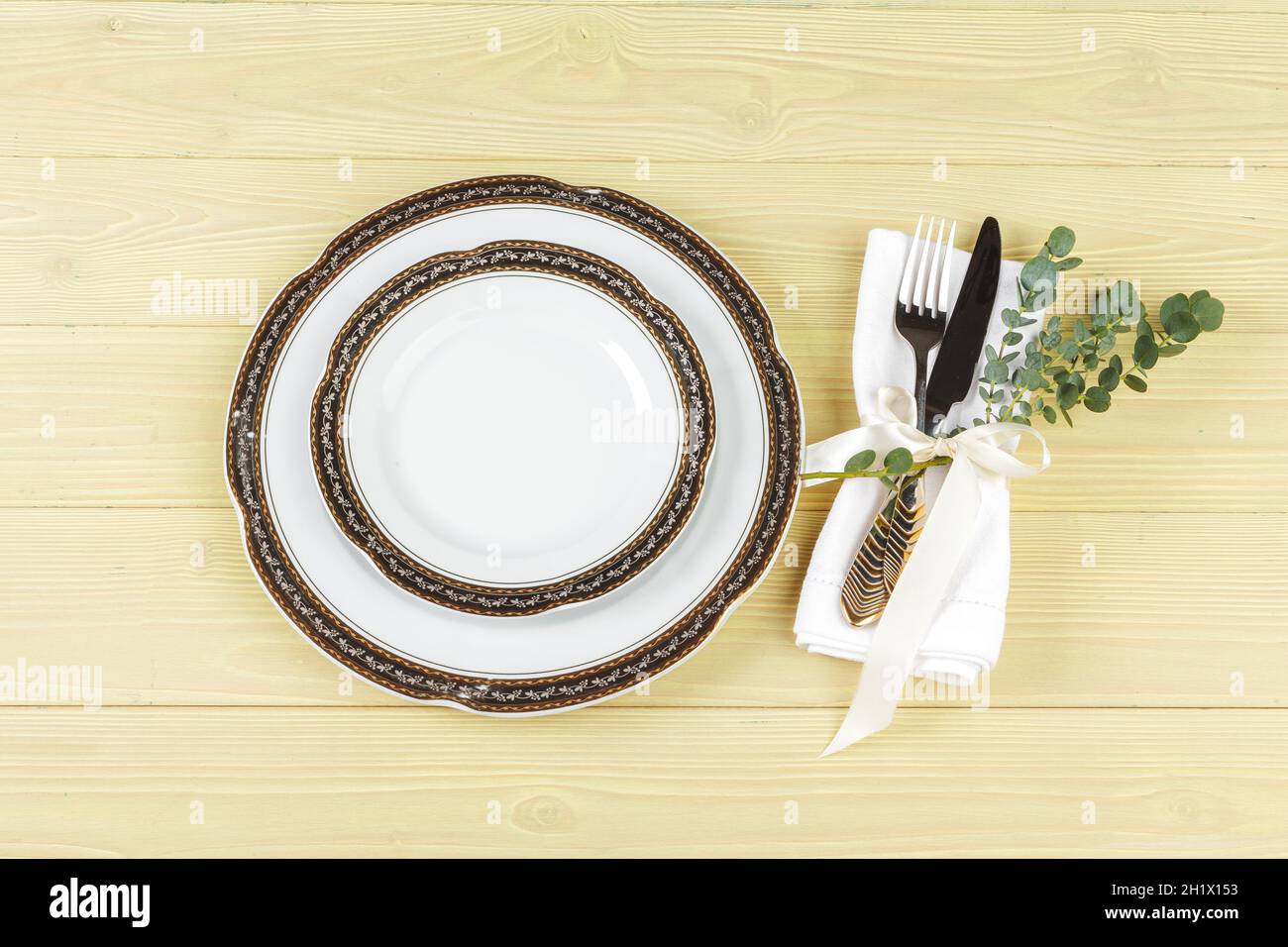 Table with plates and cutlery, view from above Stock Photo - Alamy