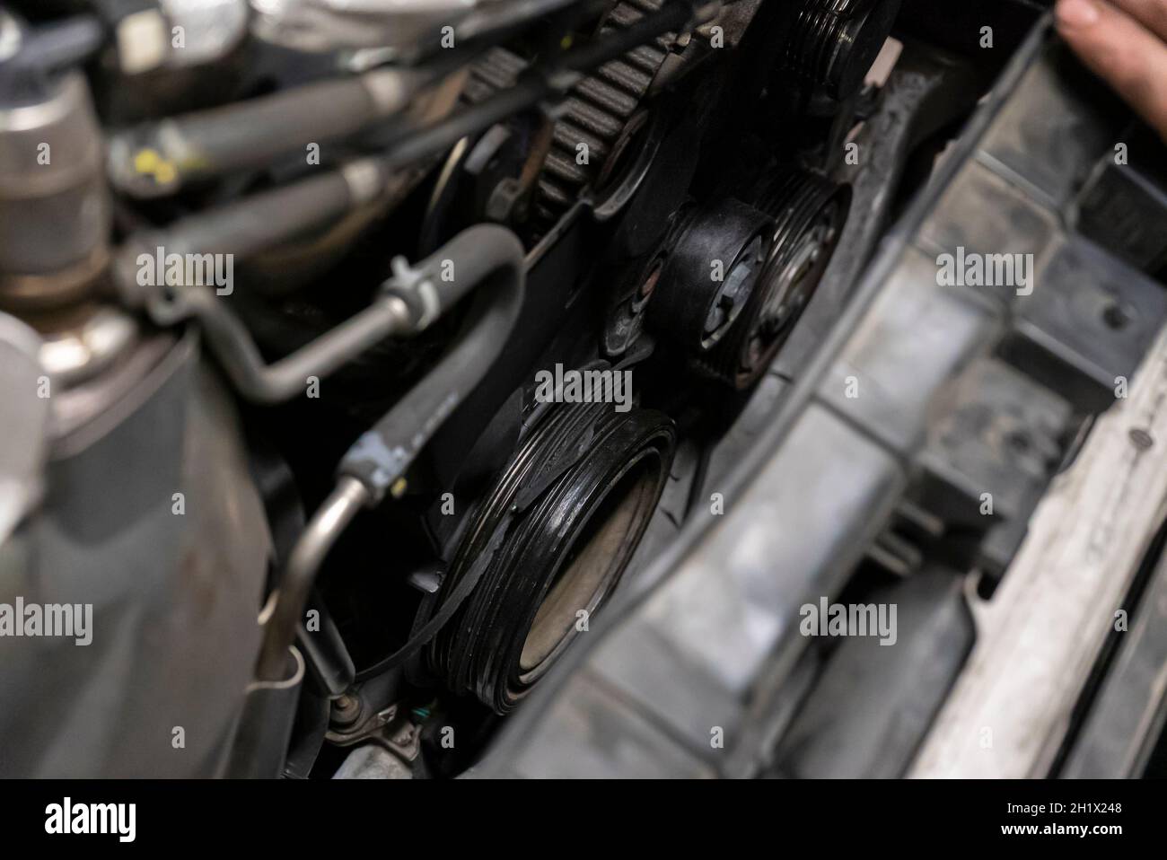 Detail of Broken belt in the car engine Stock Photo - Alamy