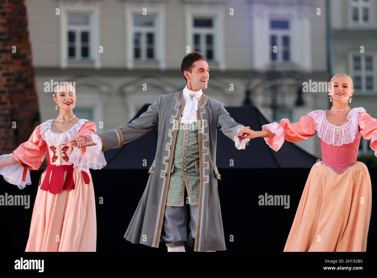 Krakow, Poland - July 25, 2021: Artists in costumes performing on stage ...