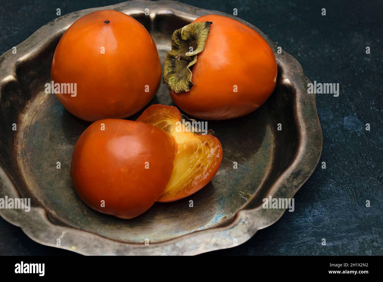 Plate sweet ripe persimmons hi-res stock photography and images - Alamy