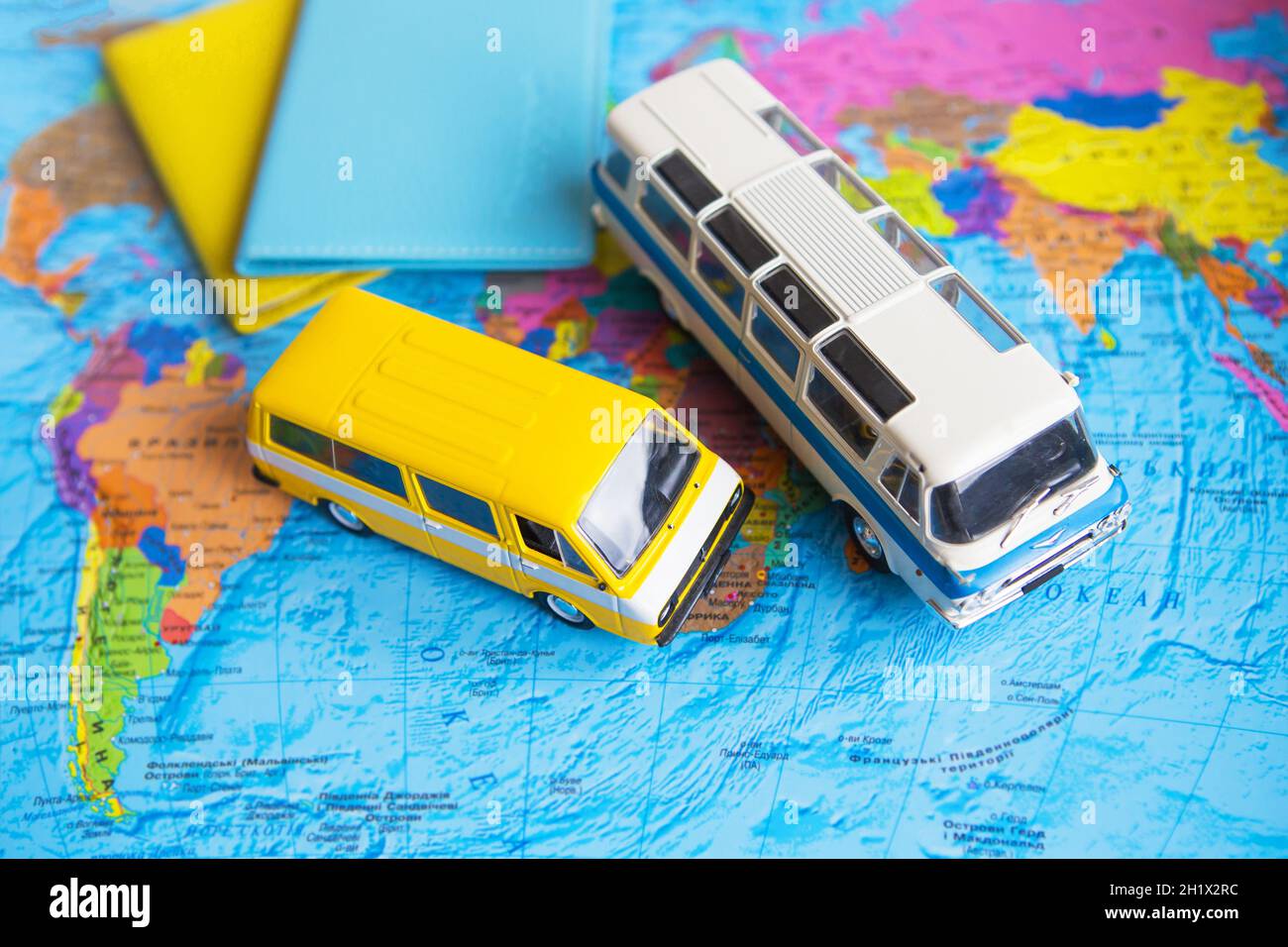 Traveling abroad by bus. Passport. World map Stock Photo - Alamy