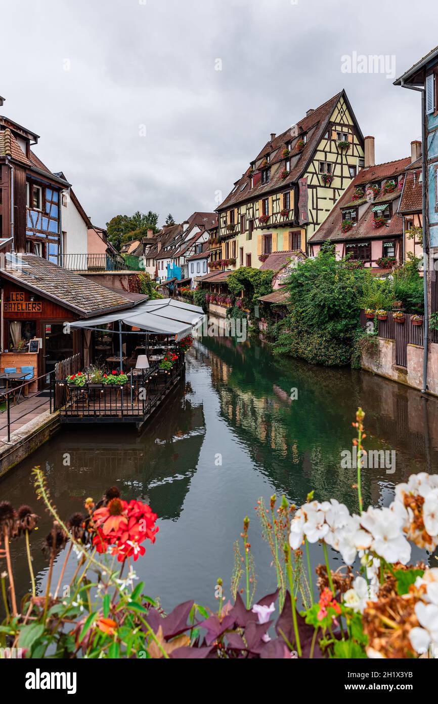 Colorful historic houses by the lake and bridge in Colmar France Stock ...