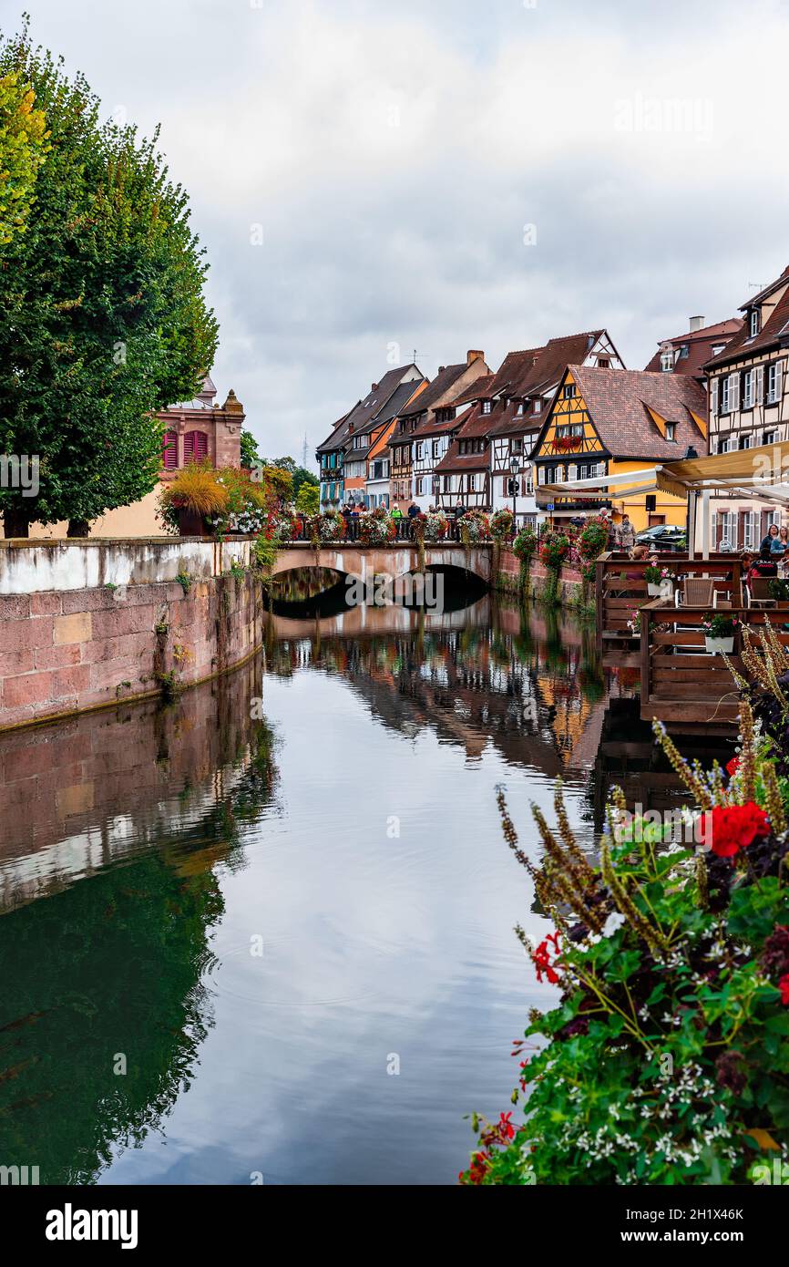 Colorful historic houses by the lake and bridge in Colmar France Stock ...