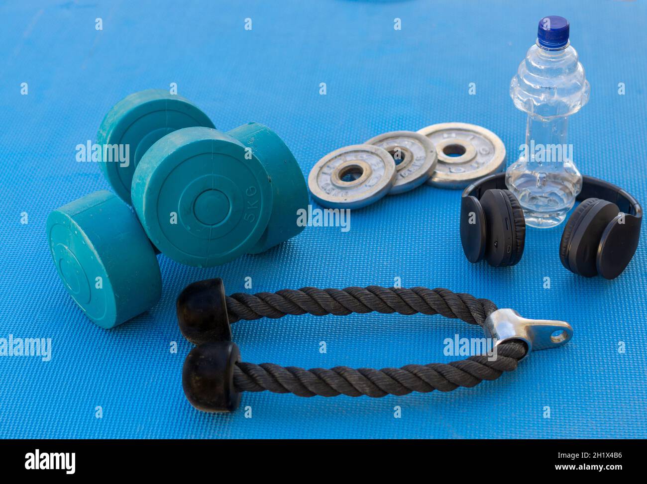 weights and fitness training equipment on the gym floor Stock Photo - Alamy