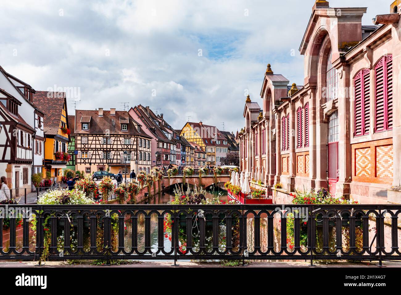 Colorful historic houses by the lake and bridge in Colmar France Stock ...