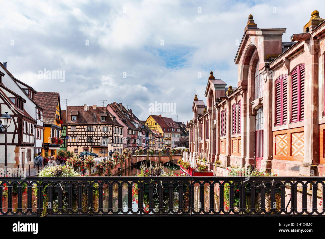 Colorful historic houses by the lake and bridge in Colmar France Stock ...