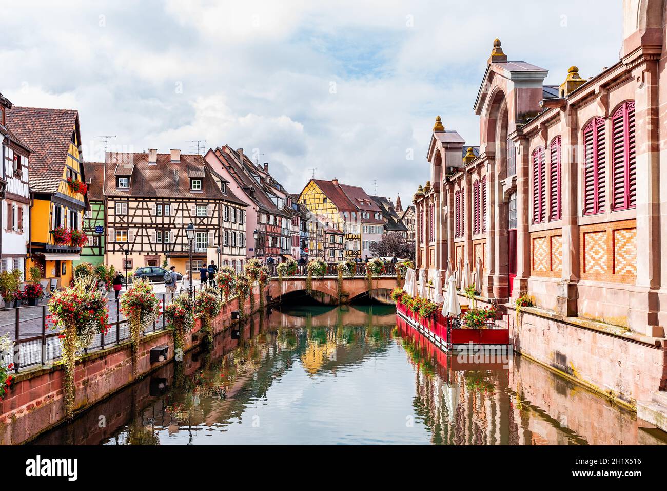 Colorful historic houses by the lake and bridge in Colmar France Stock ...