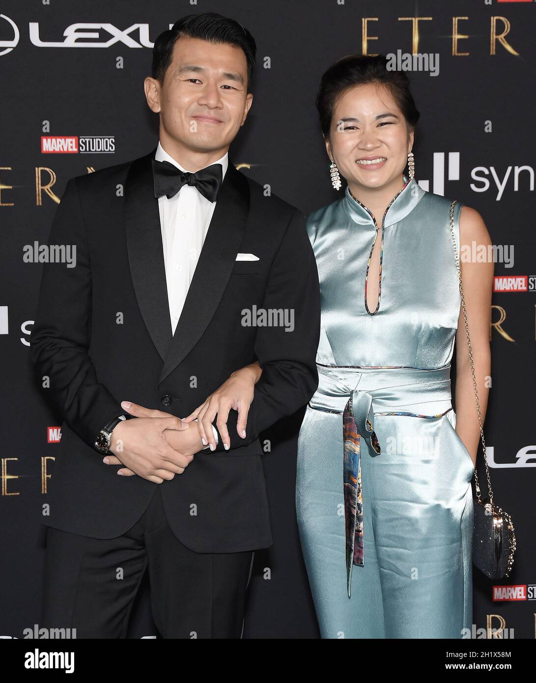 Los Angeles, USA. 18th Oct, 2021. (L-R) Ronny Chieng and Wife Hannah Pham arrives at Marvel ...