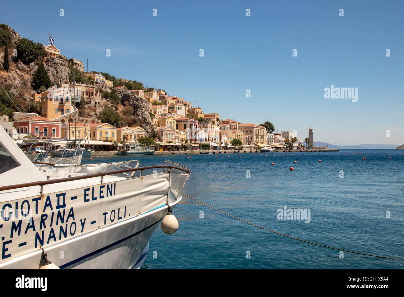 SYMI, Greece - JUN 03, 2021. The harbour of Symi town with the ...