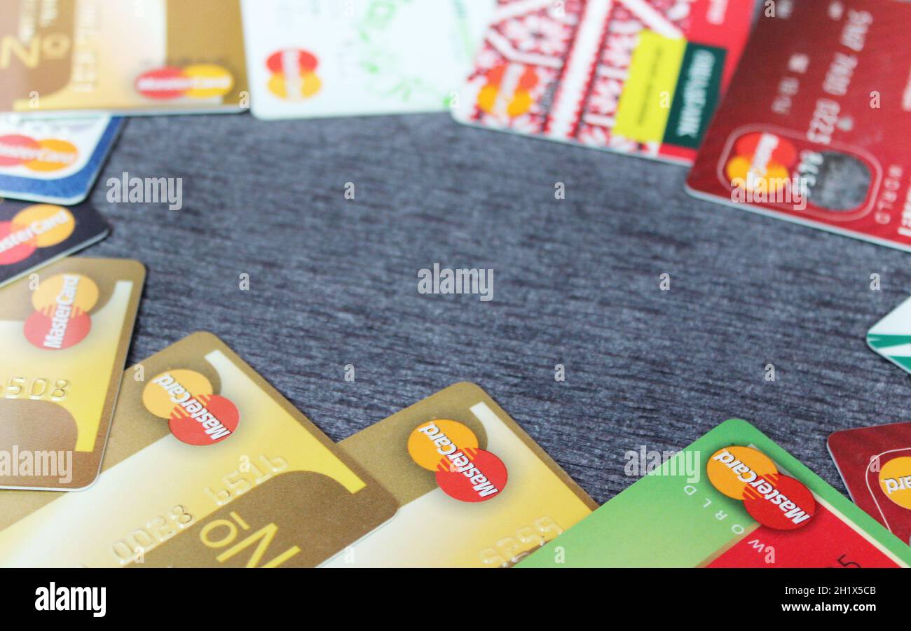 different credit cards with Mastercard brand logo. Close up of many ...
