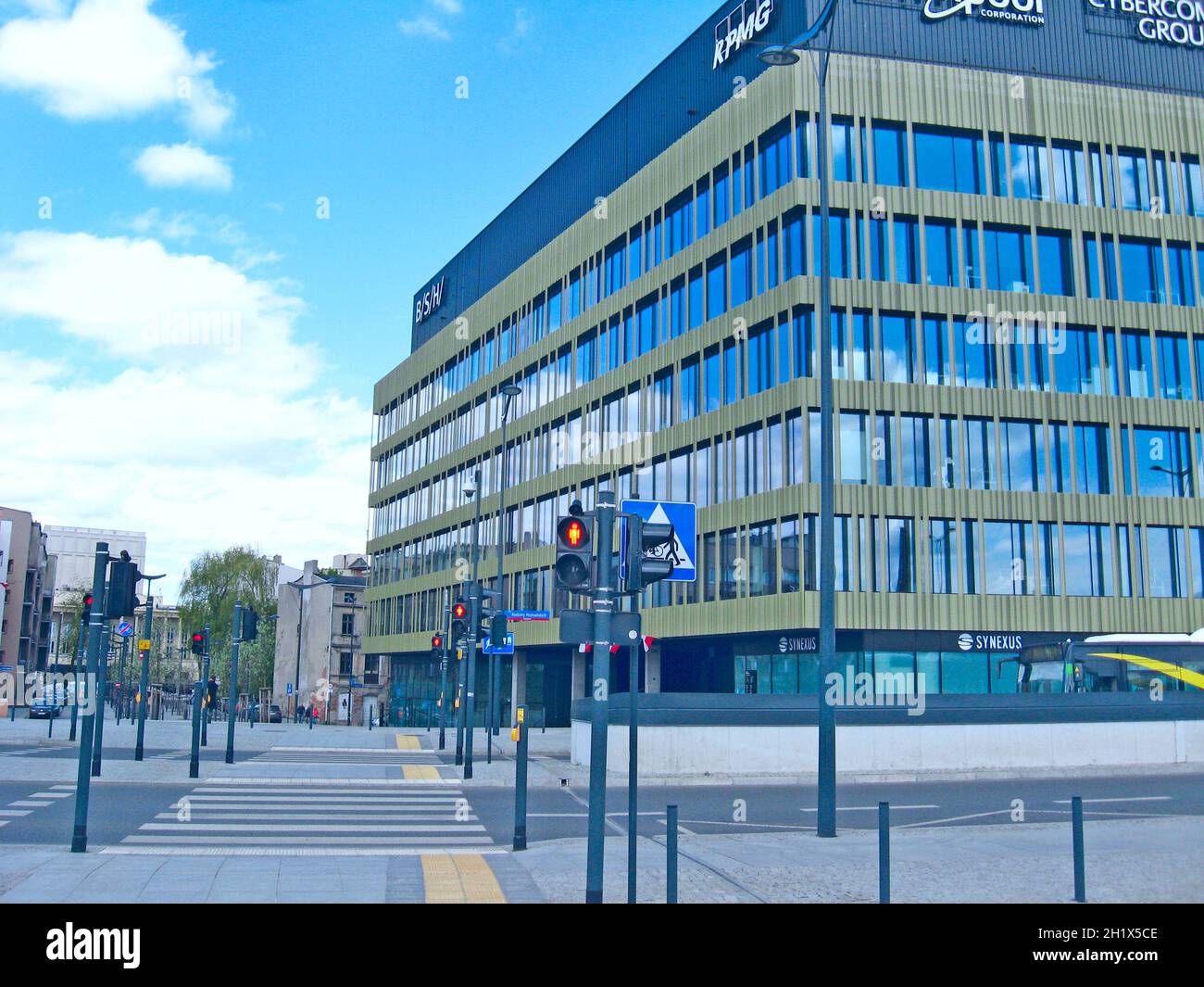 Modern architecture in Lodz. Pedestrian crossing across street with ...