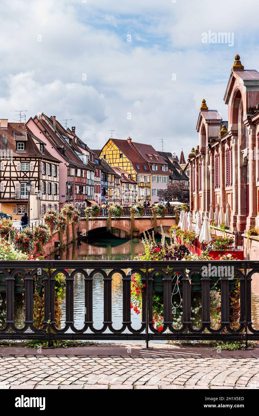 Colorful historic houses by the lake and bridge in Colmar France Stock ...