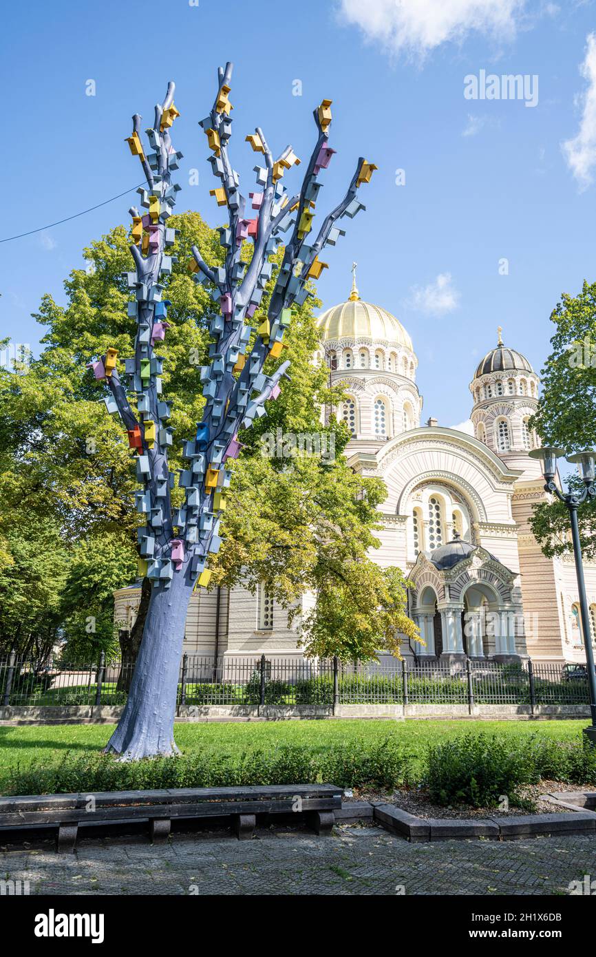 Riga, Latvia. August 2021. a colorful tree with many birdhouses in a ...