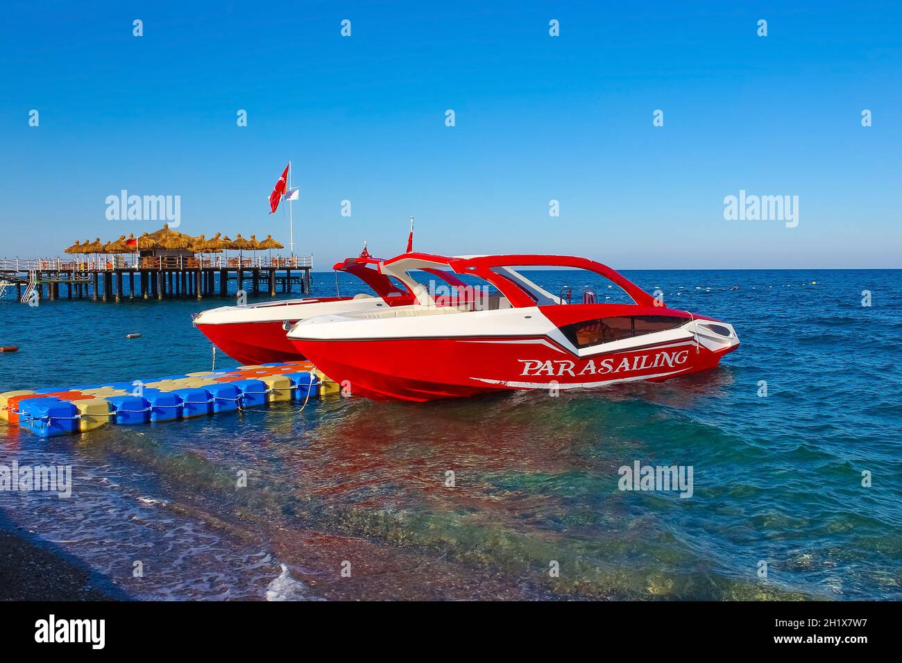 Colorful parasail boat in the sea water Stock Photo - Alamy